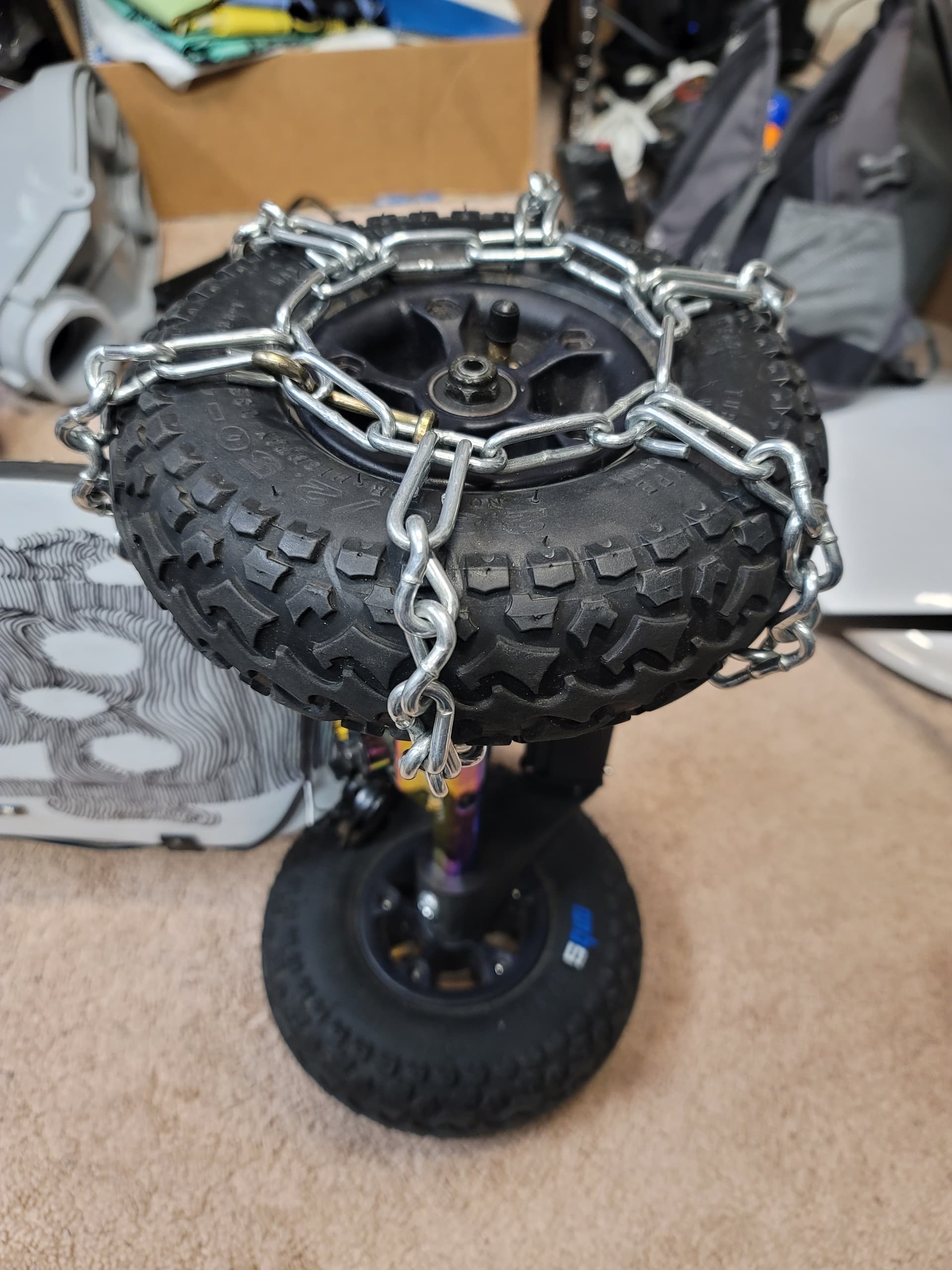 Mods to Esk8 Boards in order to Traverse snow mud sand. Tire chains studded and stuff thread. Hold My Beer esk8.news DIY Electric Skateboard Forums